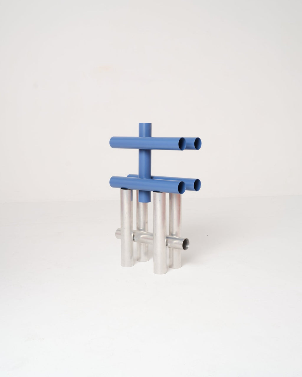 TUBE MAGAZINE RACK – FREEMAN GALLERY